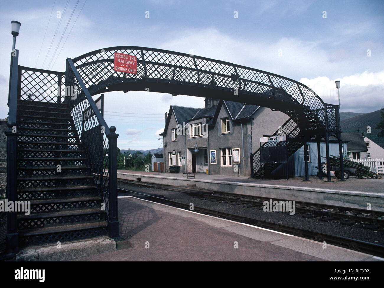 Railway passenger metal bridge at British Rail Garve railway station on ...