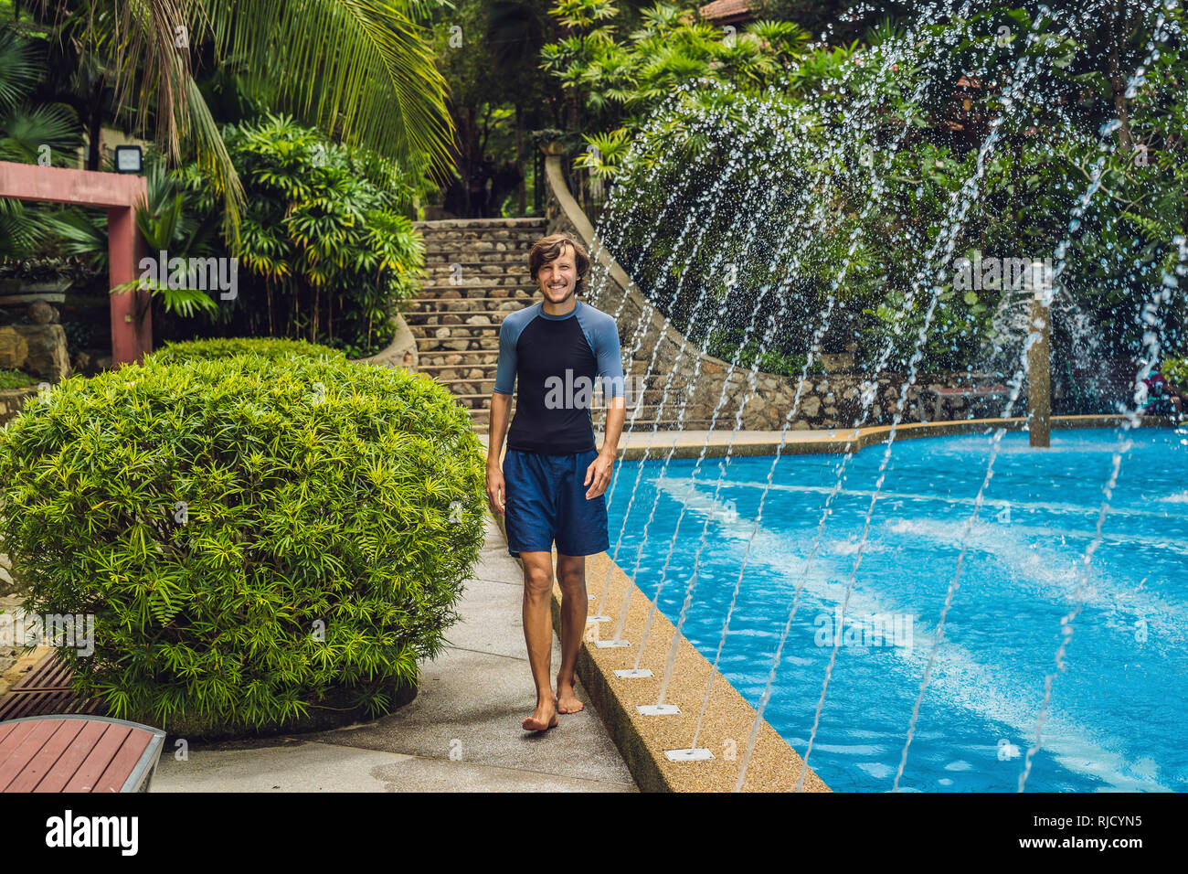 Swimming trainer in clothes for swimming, in the pool Stock Photo - Alamy