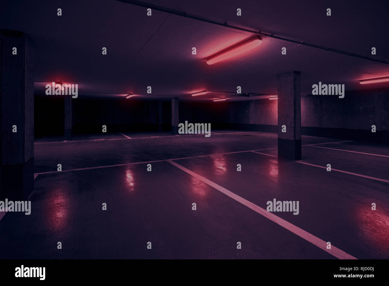 dark underground car parking deck with neon red light Stock Photo - Alamy