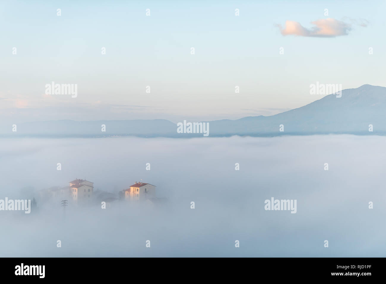 Chiusi Scalo mist fog sunrise of rooftop houses buildings in Umbria ...