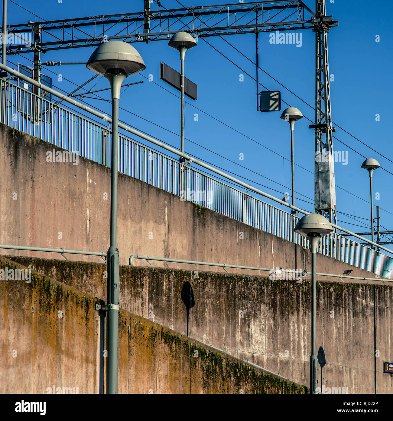 Urban Concrete Walkways and Overhead Electric Railway Cables and Street ...