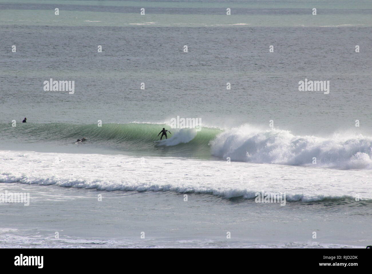 Cornish surfers in the Sea in Cornwall 5 Stock Photo - Alamy