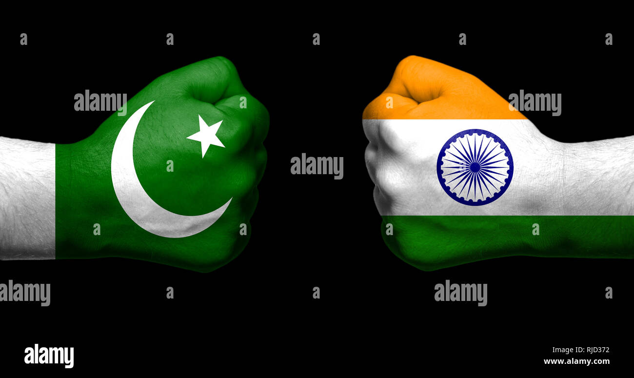Flags of India and Pakistan painted on two clenched fists facing each ...