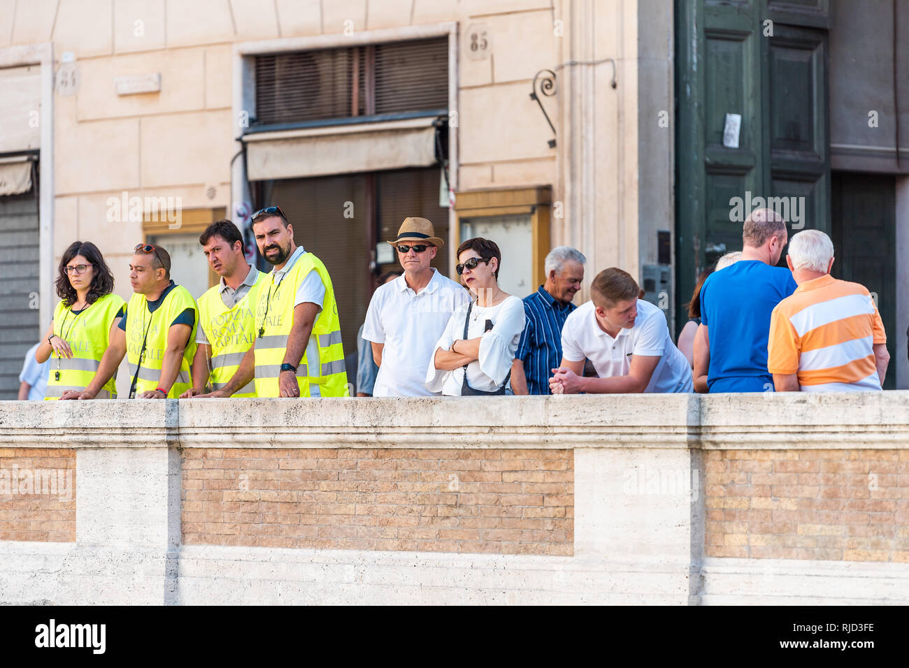 Rome, Italy - September 4, 2018: Many people workers in yellow vest ...