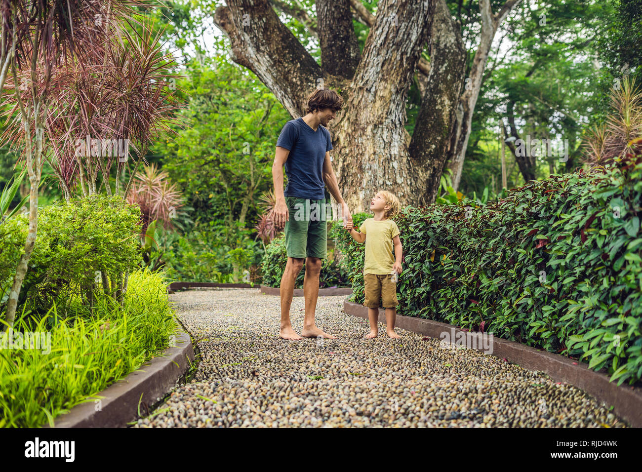 Father and son Walking On A Textured Cobble Pavement, Reflexology ...