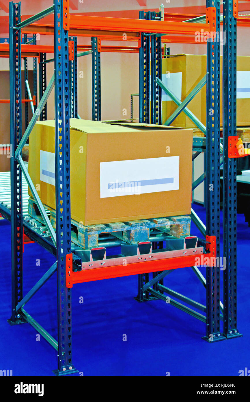 Corrugated carton box at shelf in storehouse Stock Photo - Alamy