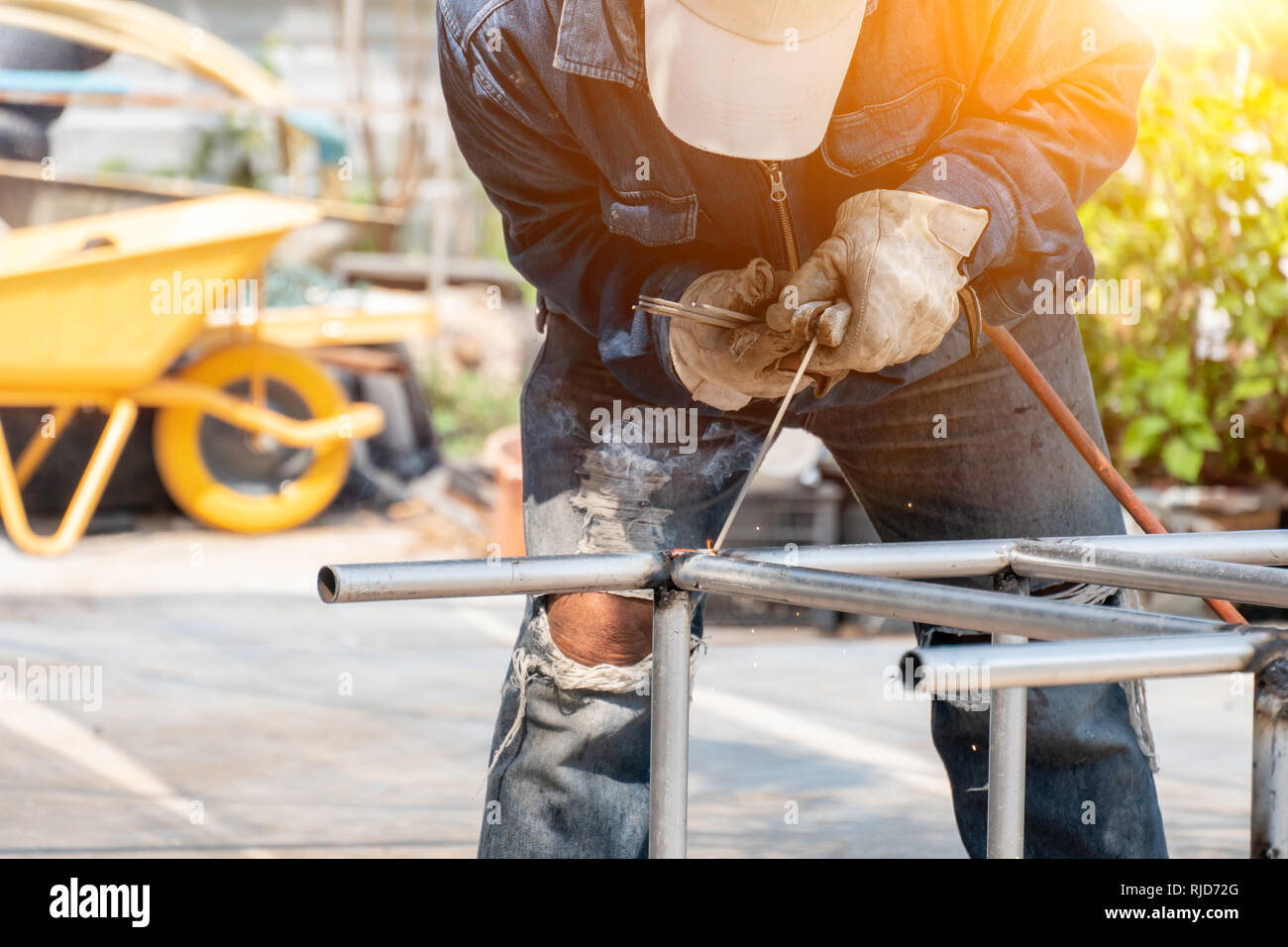 The welder is welding the steel frame. Labor and industrial work hard ...
