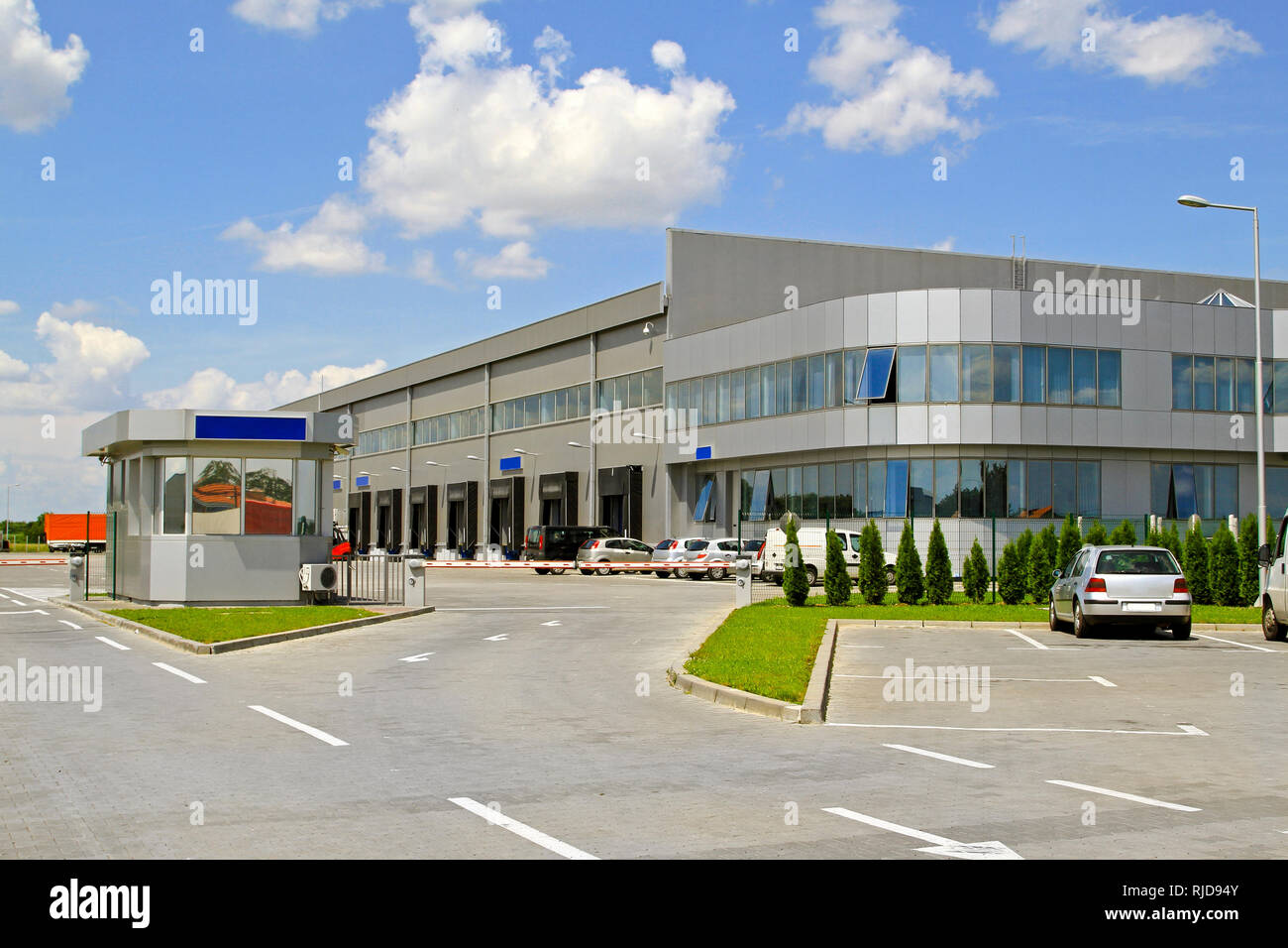 Gateway entrance to big silver industrial warehouse Stock Photo - Alamy