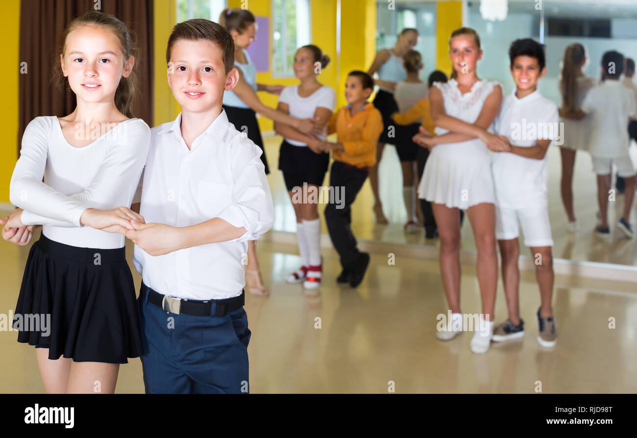 Smiling children are dancing in pairs in class Stock Photo - Alamy