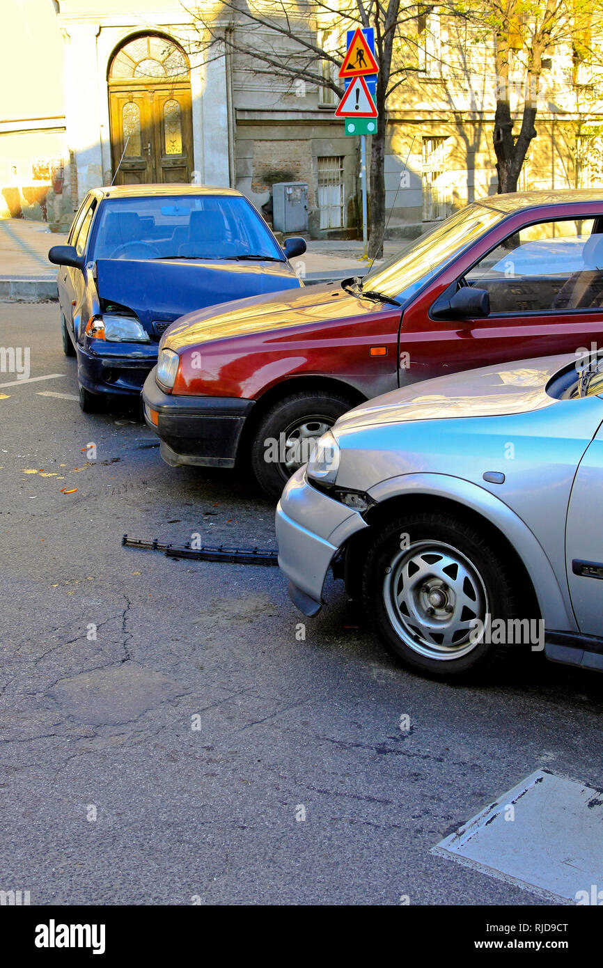 Three car traffic accident at street intersection Stock Photo - Alamy