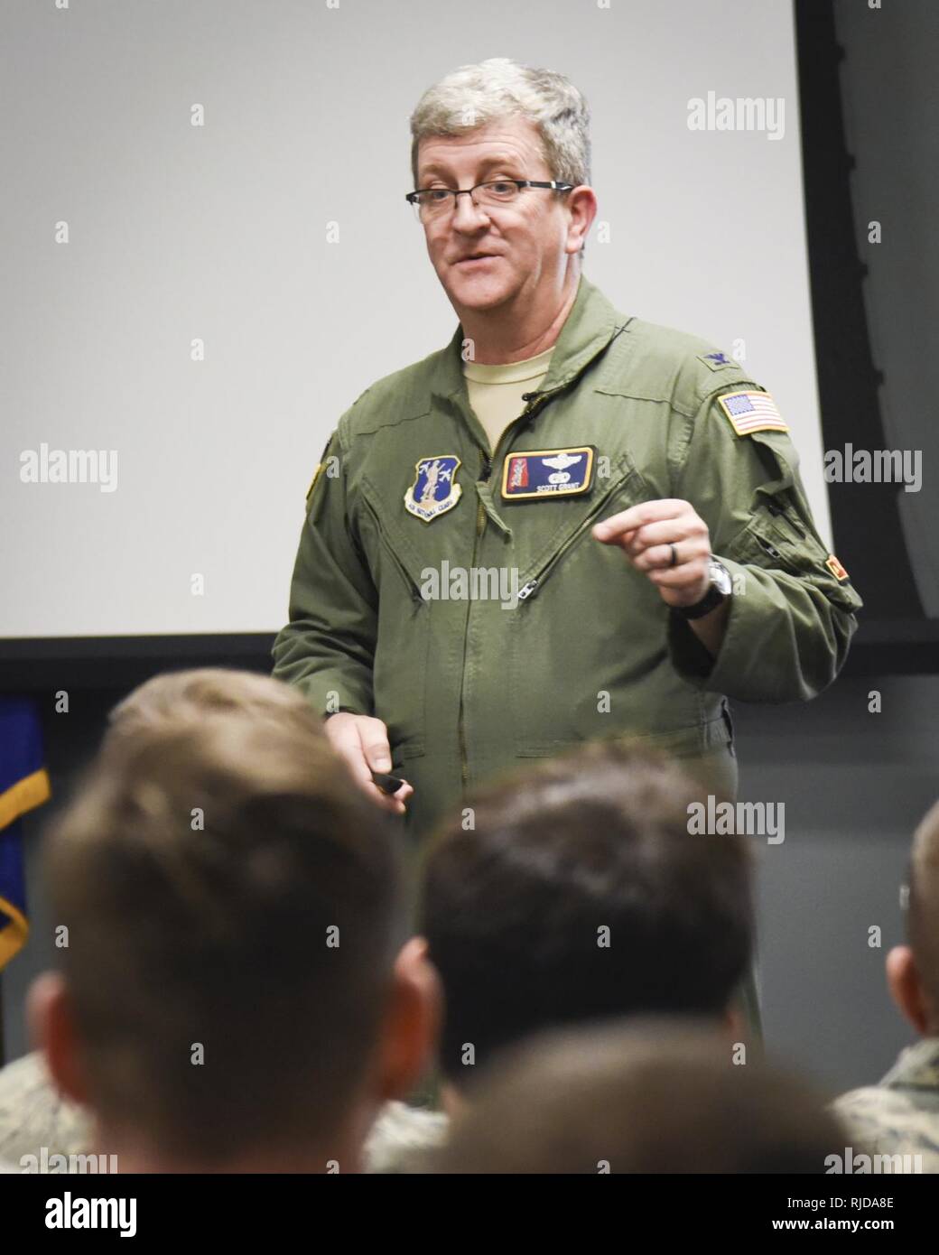 Colonel Scott Grant, 117th Air Refueling Wing Commander, speaks to the ...