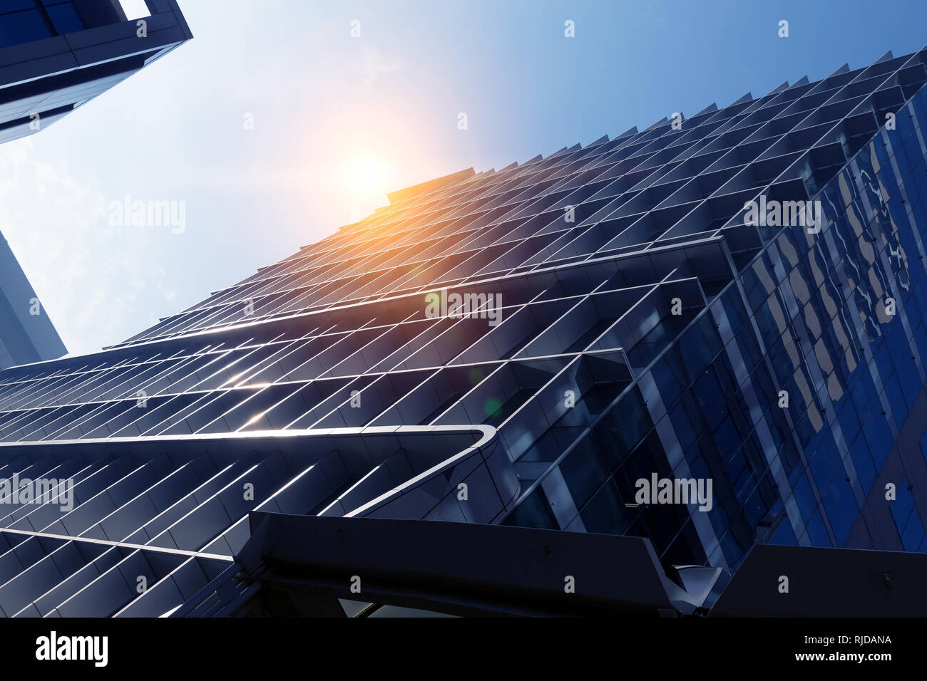 Bottom angle view of glass blue building Stock Photo - Alamy