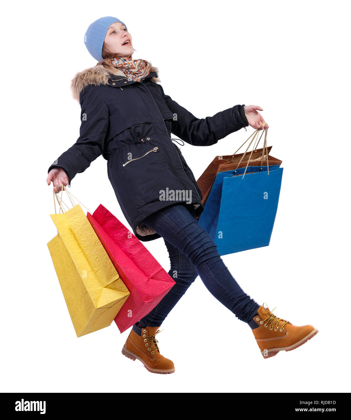 Falling woman with shopping bags. beautiful girl in motion. backside ...