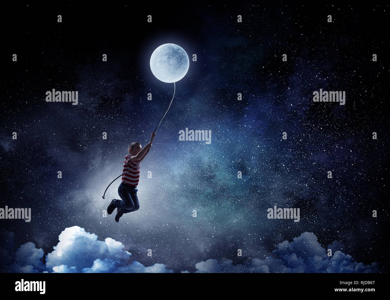 Kid boy flying at night on moon balloon . Mixed media Stock Photo - Alamy