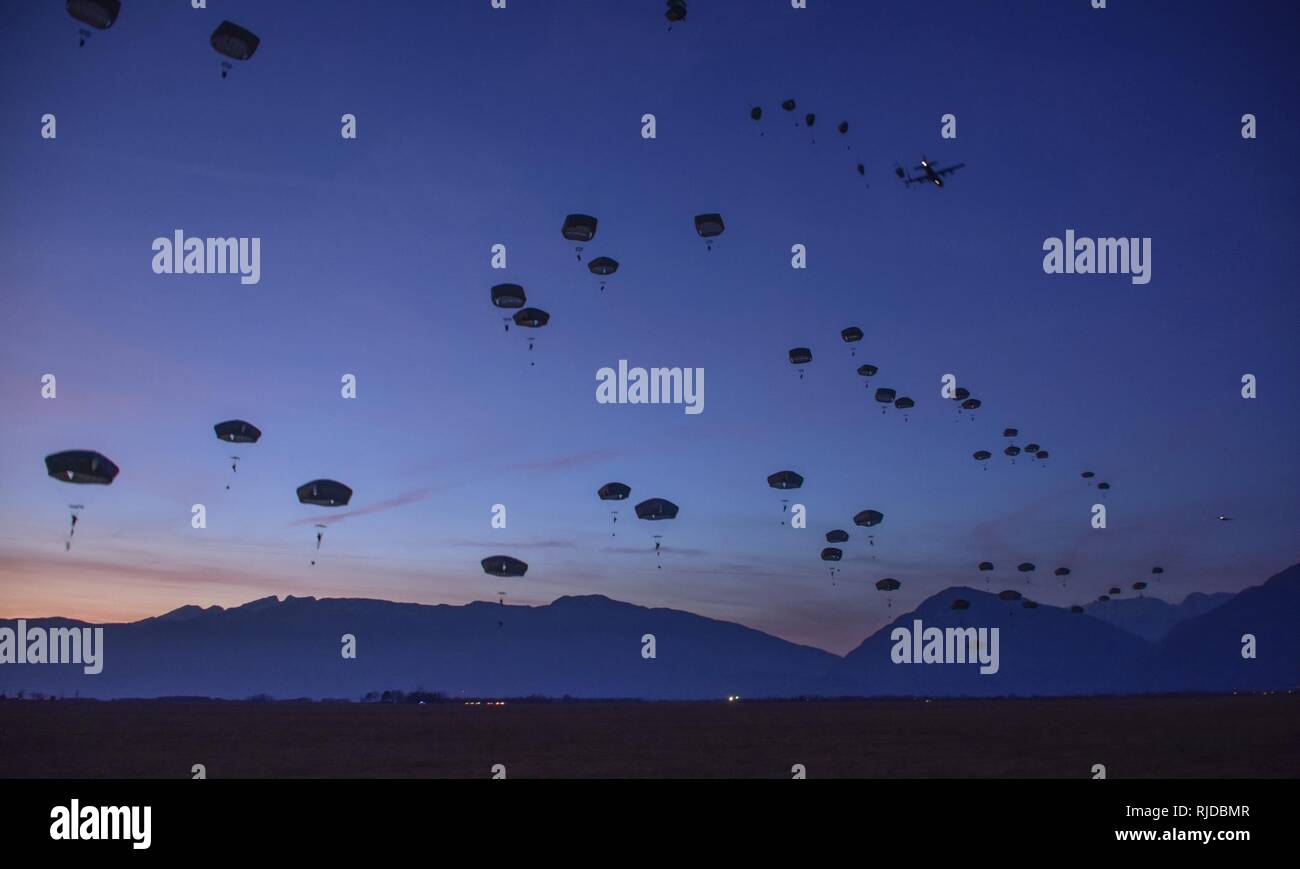 Paratroopers from the 173rd Airborne Brigade jump into the night skies ...