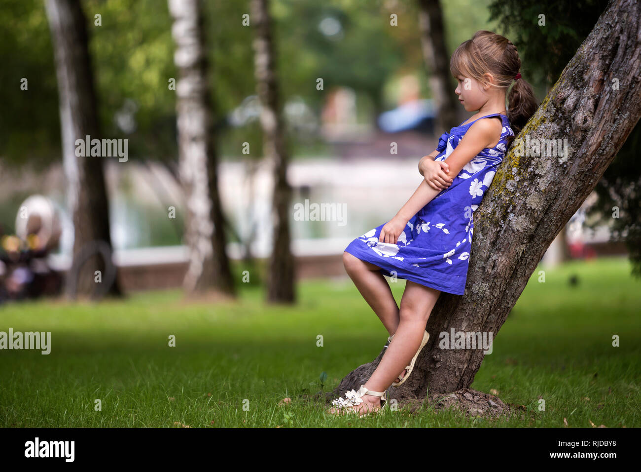 Adorable pretty young child girl with beautiful long blond hair in ...