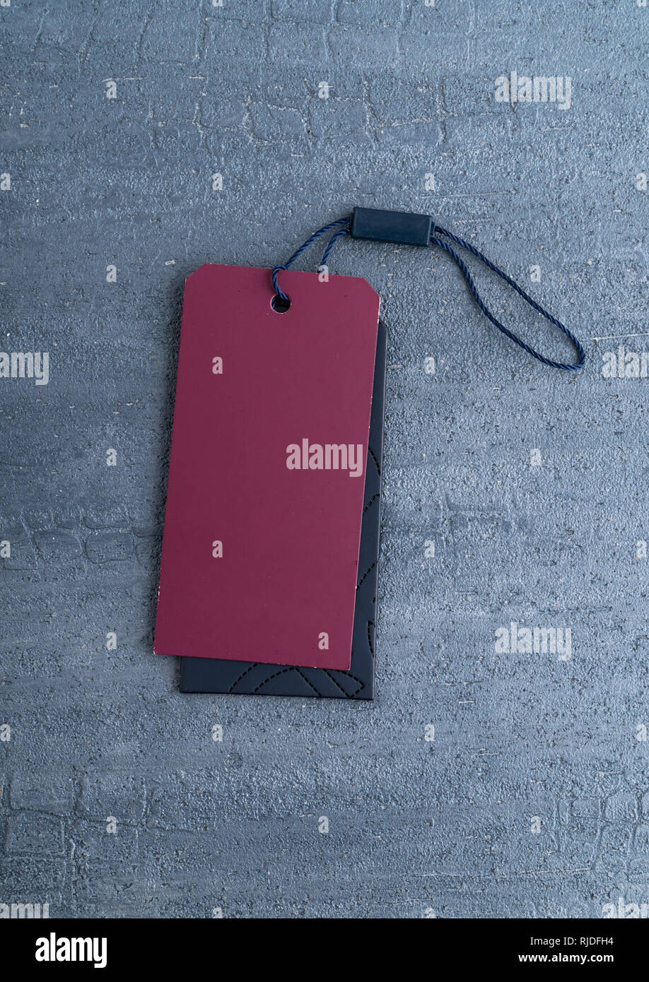 two price tags isolated on a decorative textured background. top view ...