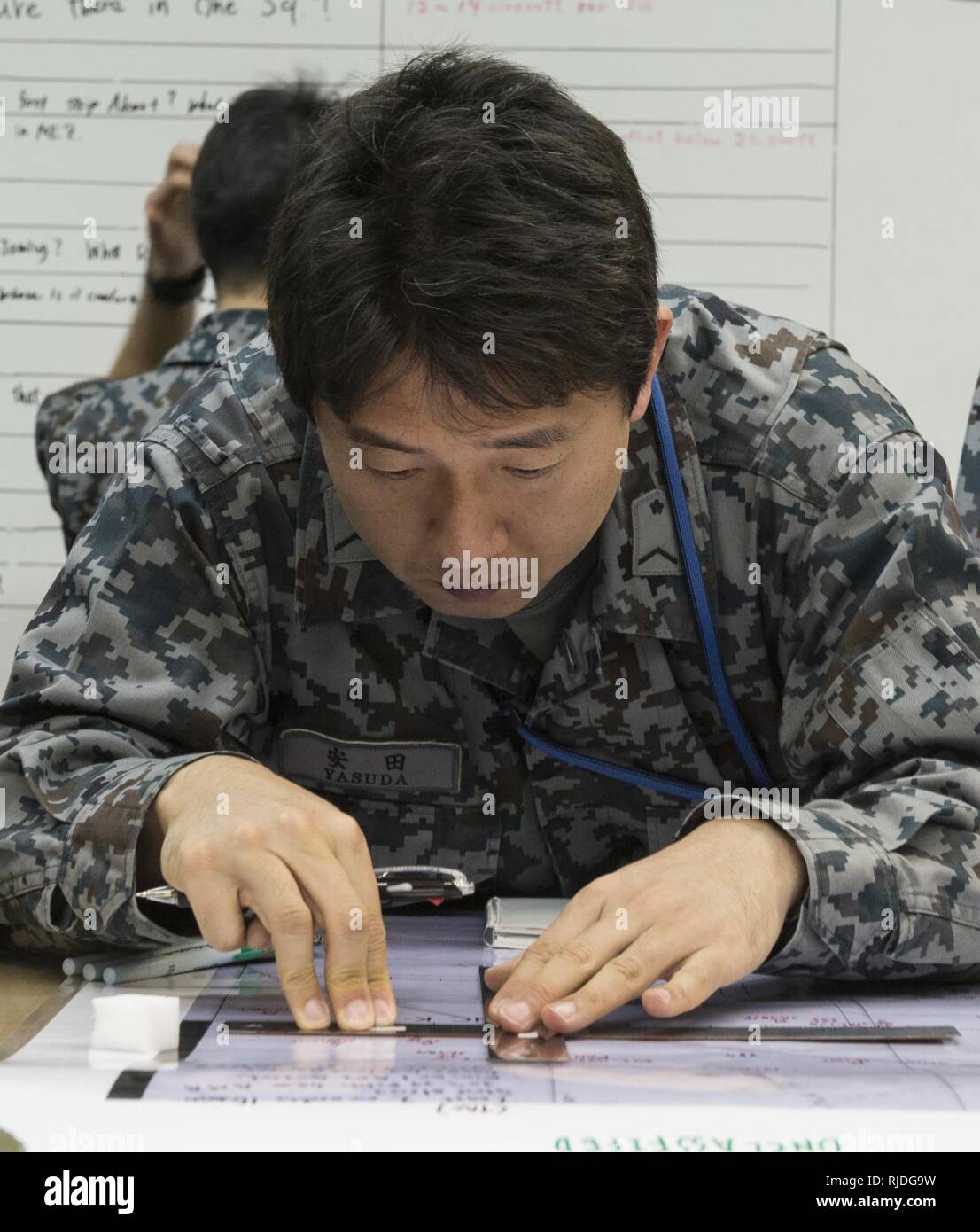 Japan Air Self Defense Force members identify important information by ...