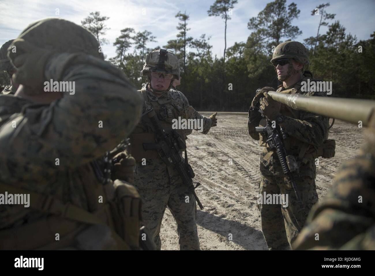 Cpl. Ethan Lousberg briefs his team before moving downrange to place ...