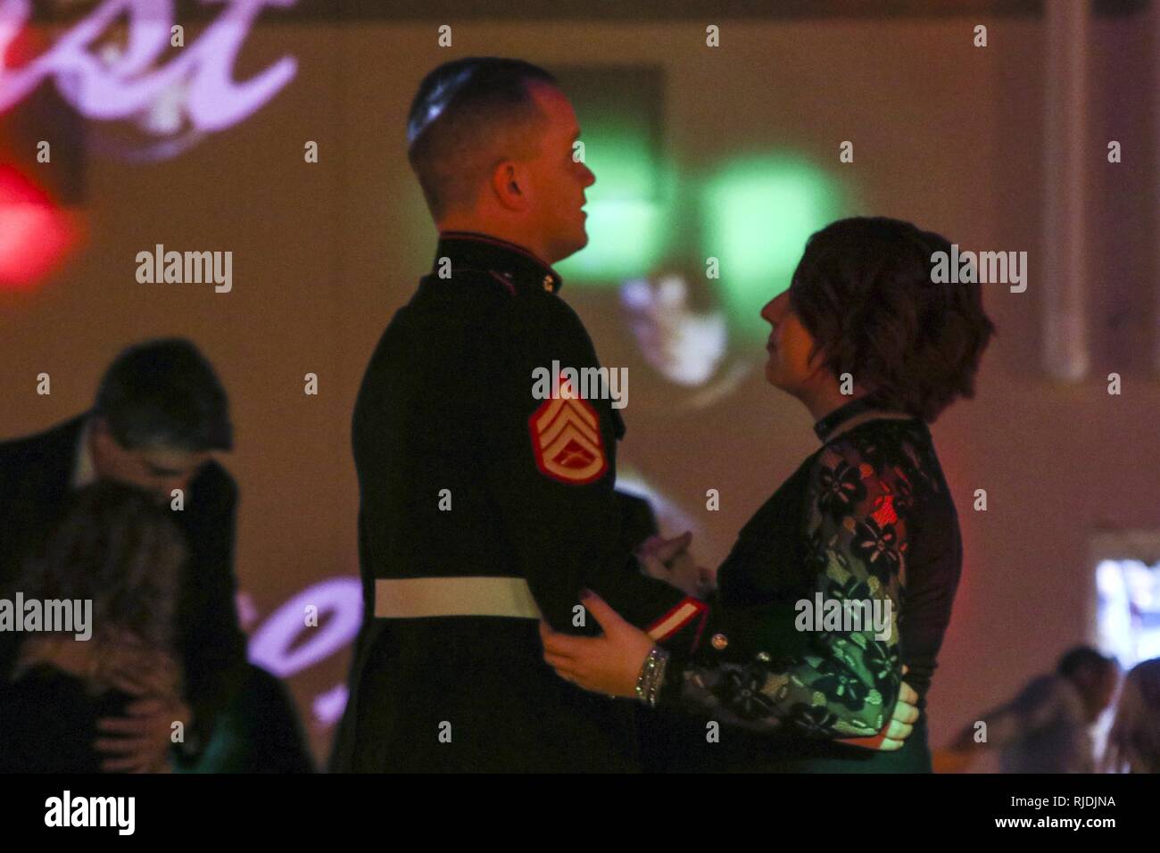 U.S. Marine Staff Sgt. Brian D. Raney and Raven Campbell dance at St ...