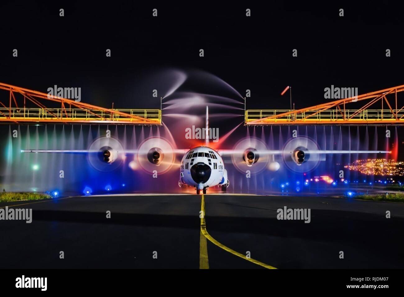 A U.S. Coast Guard HC-130 Hercules aircraft is rinsed down at Air ...