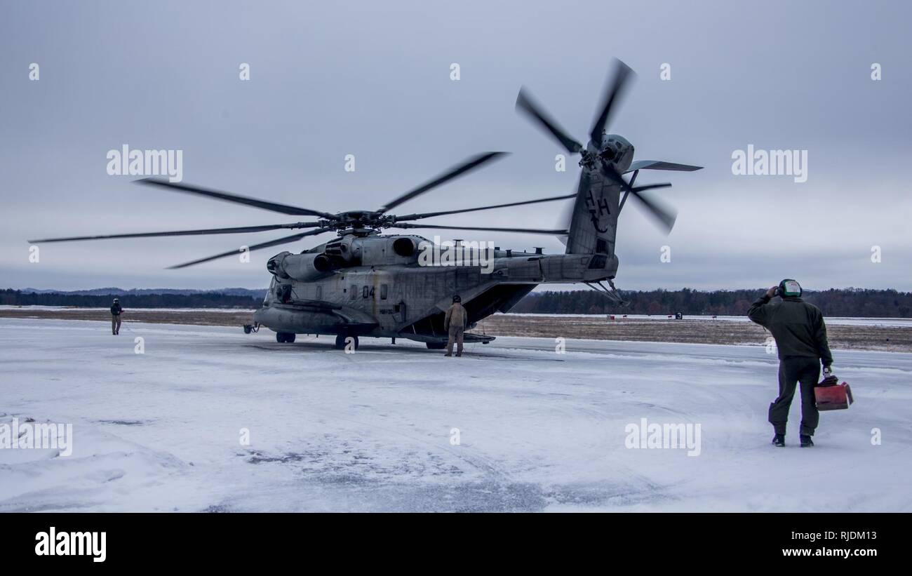 U.S. Marines with Marine Heavy Helicopter Squadron 366 prepare a CH-53E ...