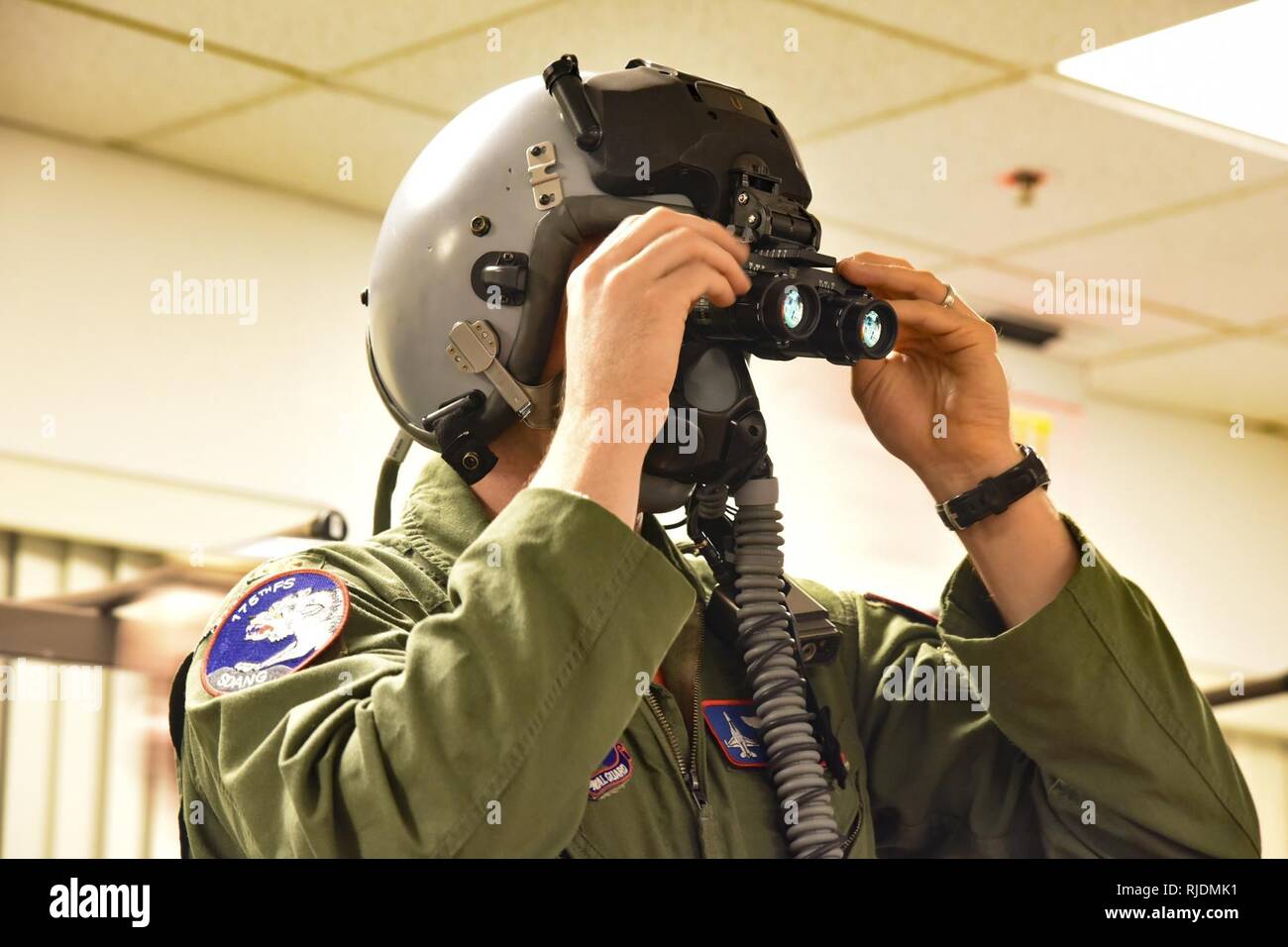 Maj. Casey Minor, 114th FW pilot, tries on the digital eye piece add-on ...