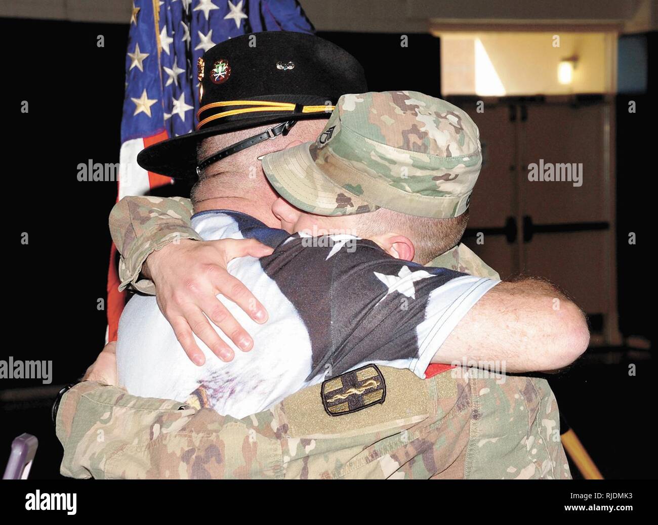 Staff Sgt. Joseph Clifford gets a hug from his dad, Michael Clifford ...