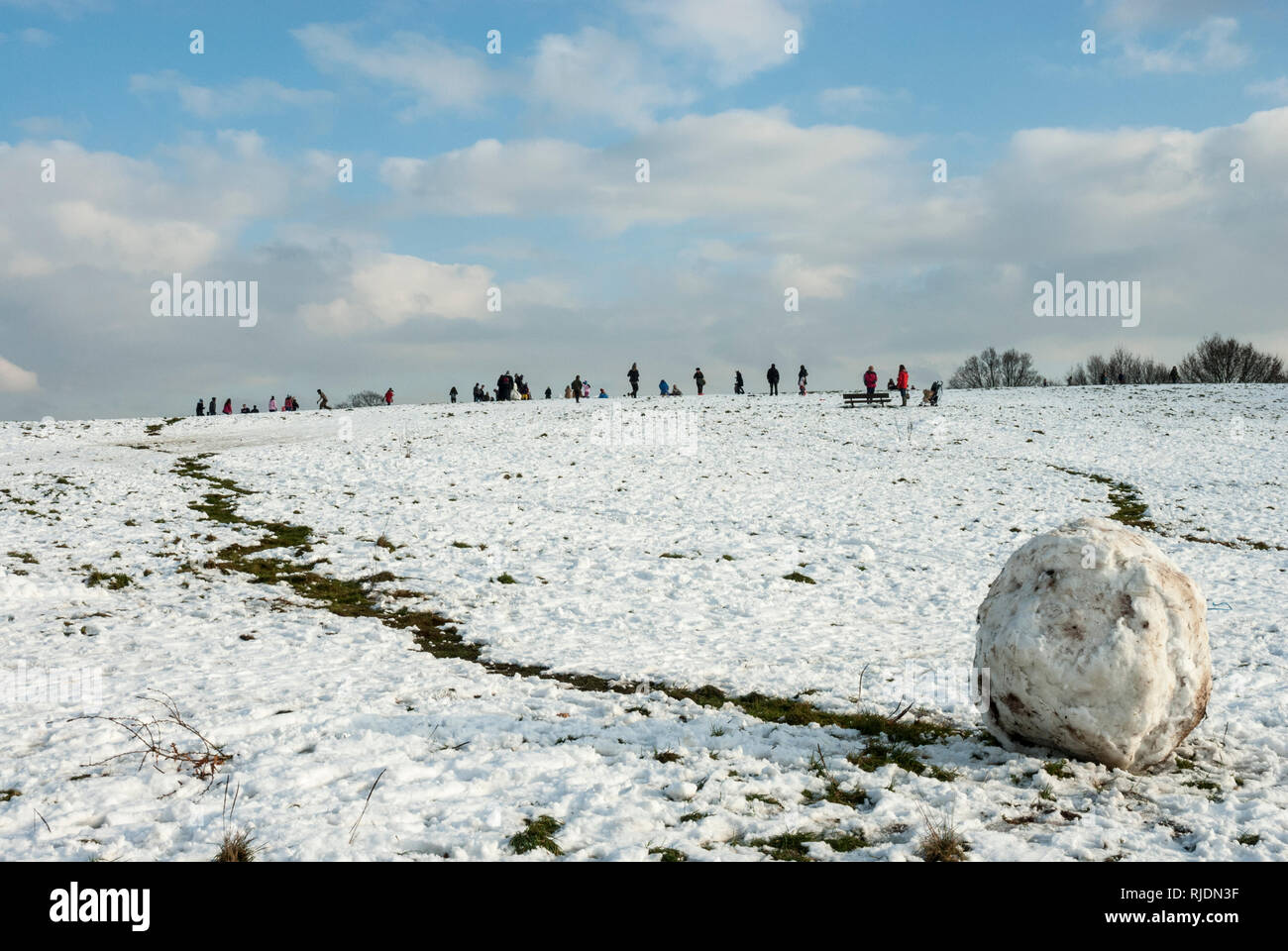 Snow ball rolling down hill hi-res stock photography and images - Alamy