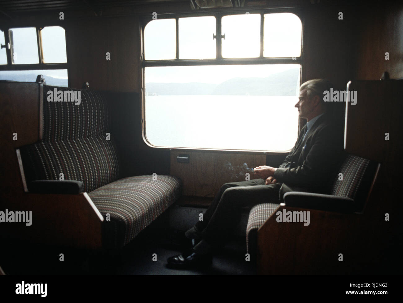 Passenger smoking on Kyle of Lochalsh Line British Rail train, Scotland ...