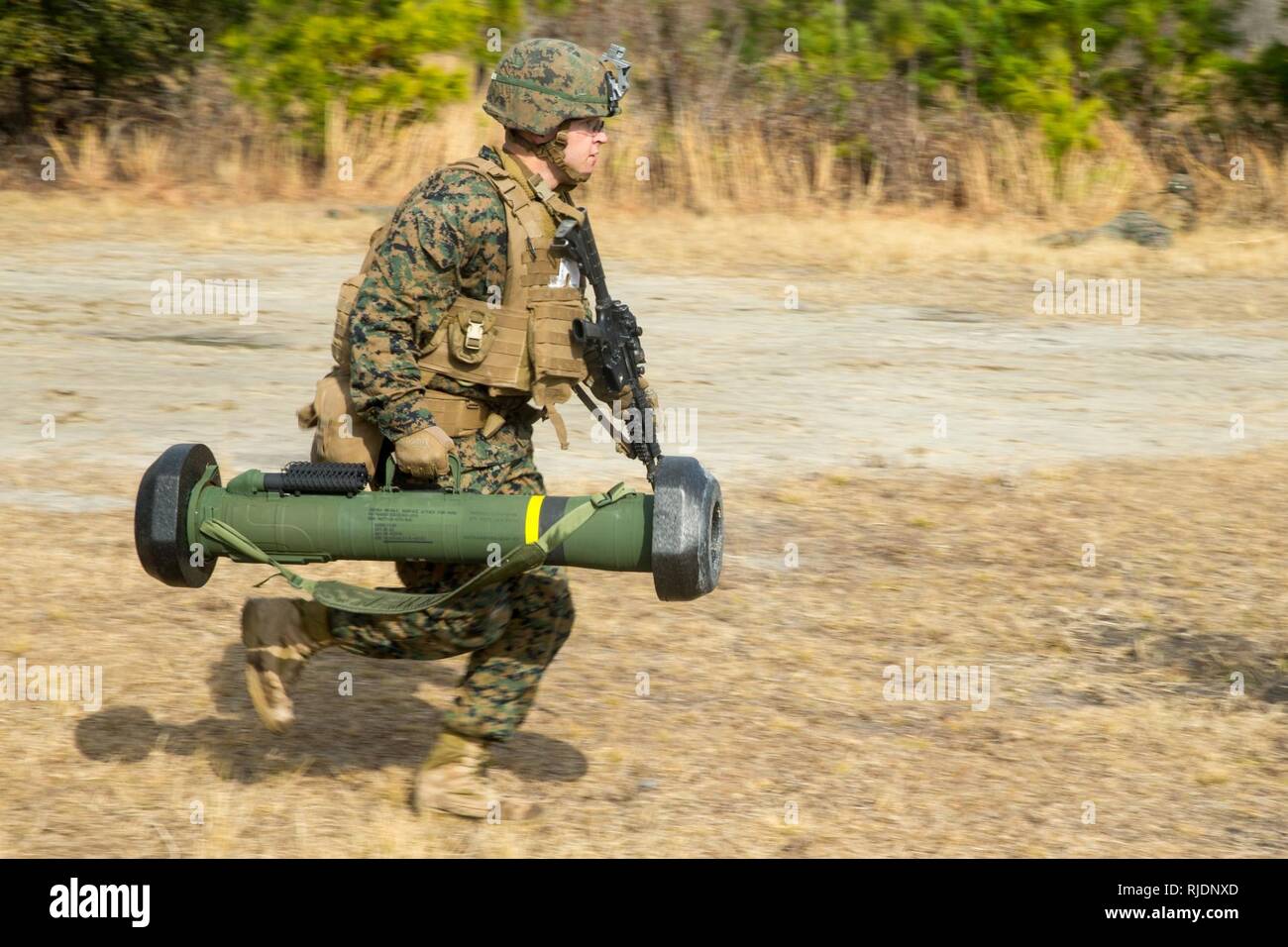 A U.S. Marine with Weapons Company, 1st Battalion, 6th Marine Regiment ...