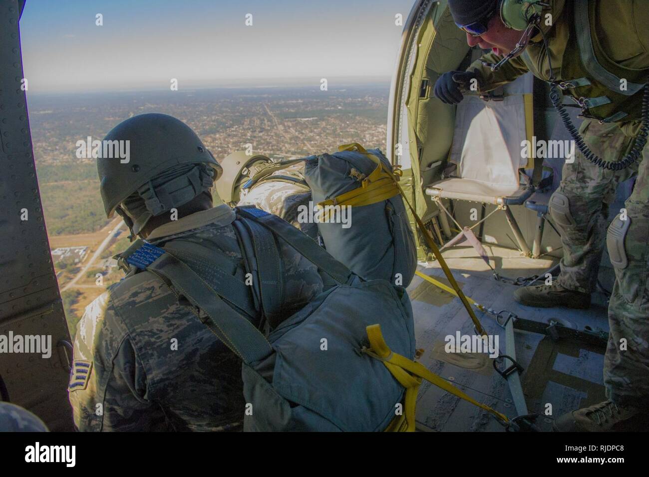 A jumpmaster assigned to the Joint Communications Support Element gives ...