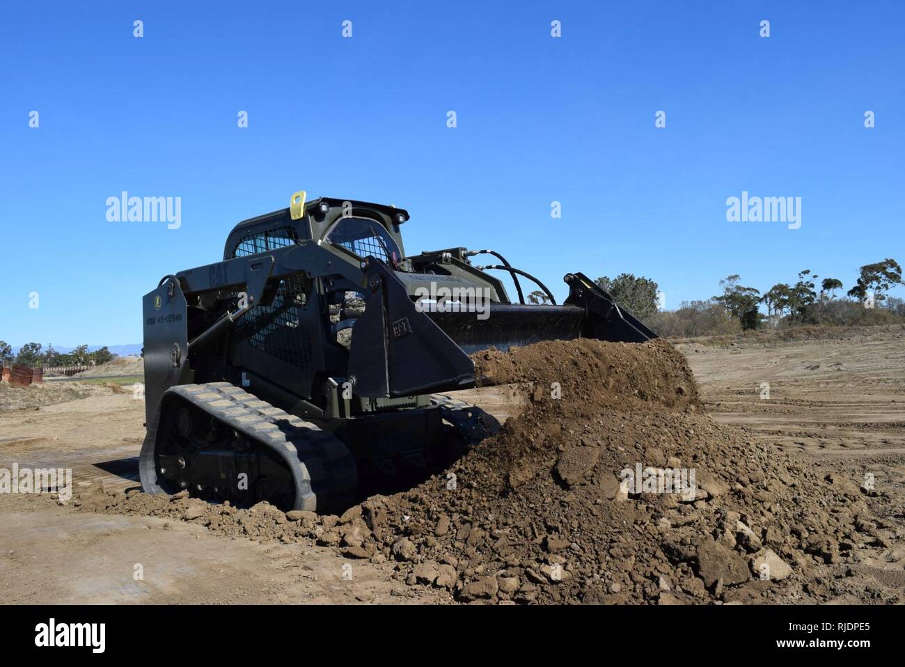 DOZER FIELD, PORT HUENEME, Calif. (Jan. 23,2018) A Seabee, assigned to ...