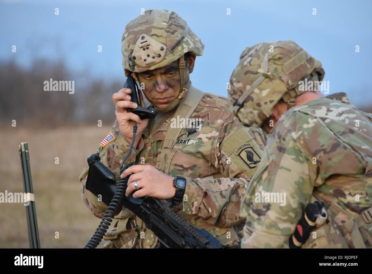 A drop zone safety officer and NCO ensure the safety of paratroopers ...