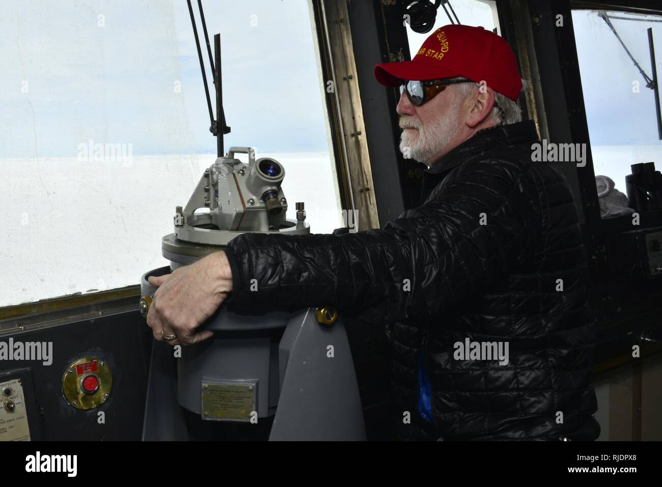 Capt. David Snider of the Nautical Institute looks on as the Coast ...