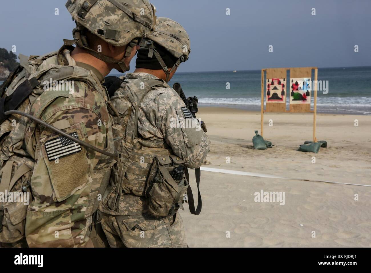 U.S. Army Spc. Florendo, right, assigned to the 2nd Battalion, 4th ...