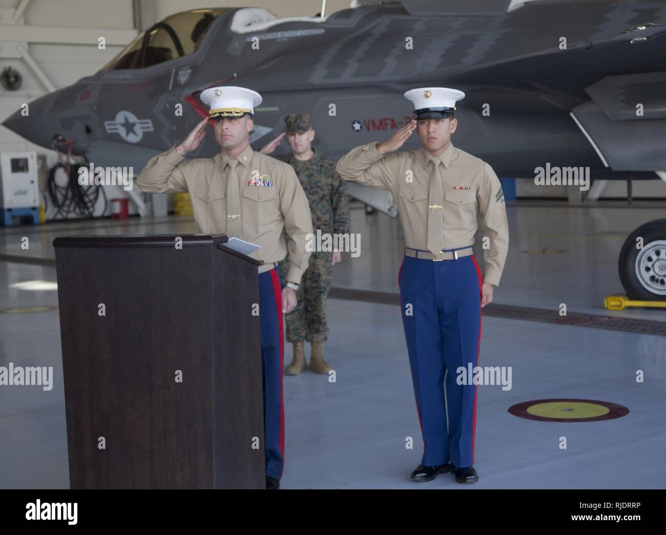 U.S. Marines with Marine Fighter Attack Squadron (VMFA) 211 salute the ...