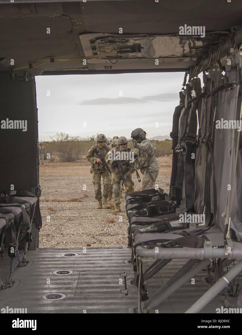 Soldiers with 1st Battalion, 158th Infantry Regiment board a UH-60 ...