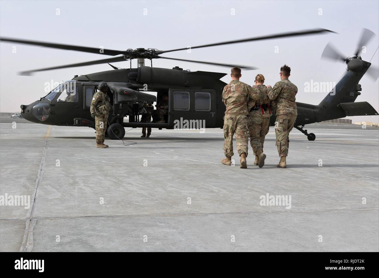 CAMP ARIFJAN, Kuwait – Spc. Cody Scriven and Spc. Scott Ferris guide ...