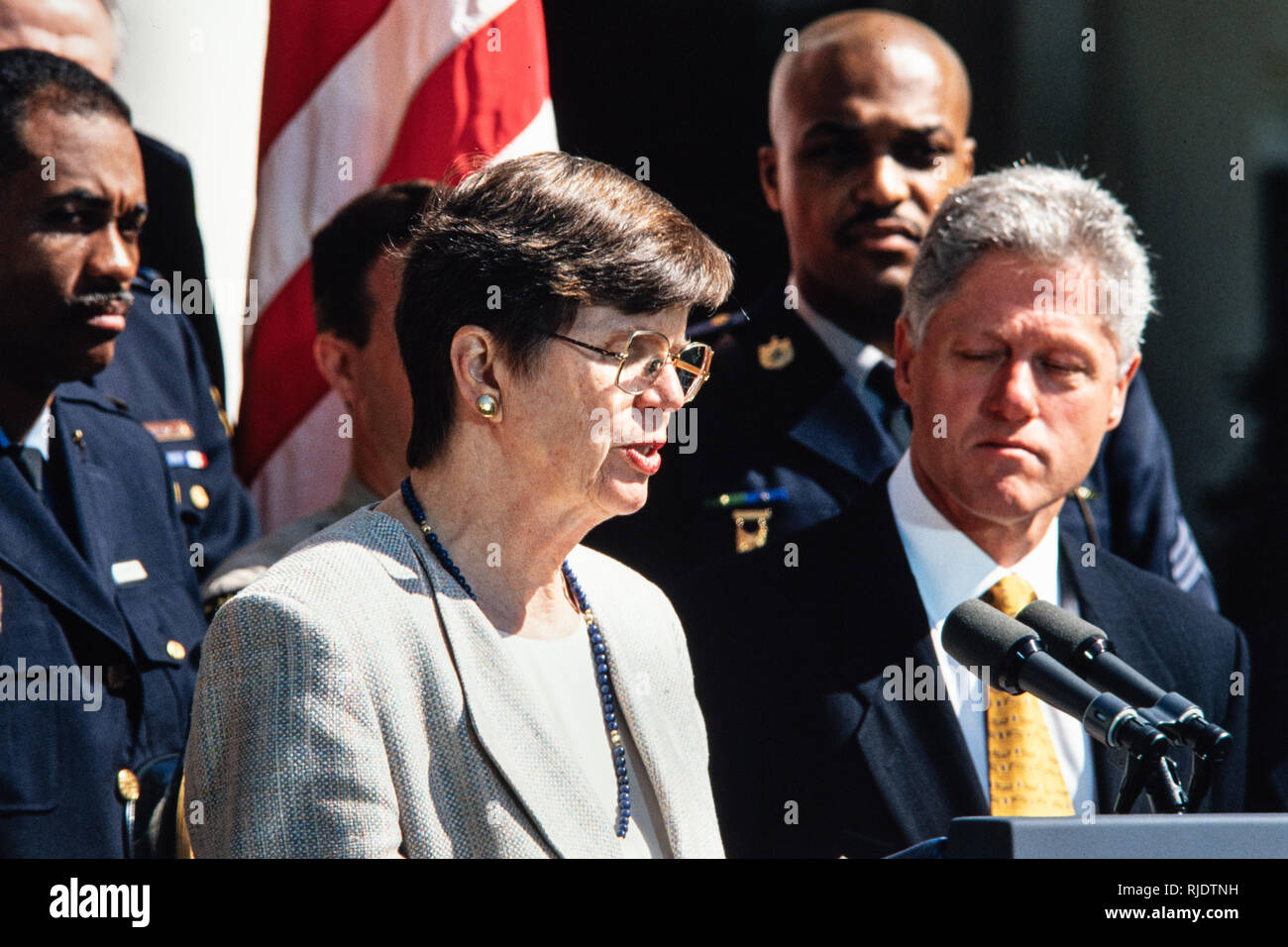 U.S Attorney General Janet Reno, left, speaks as President Bill Clinton ...