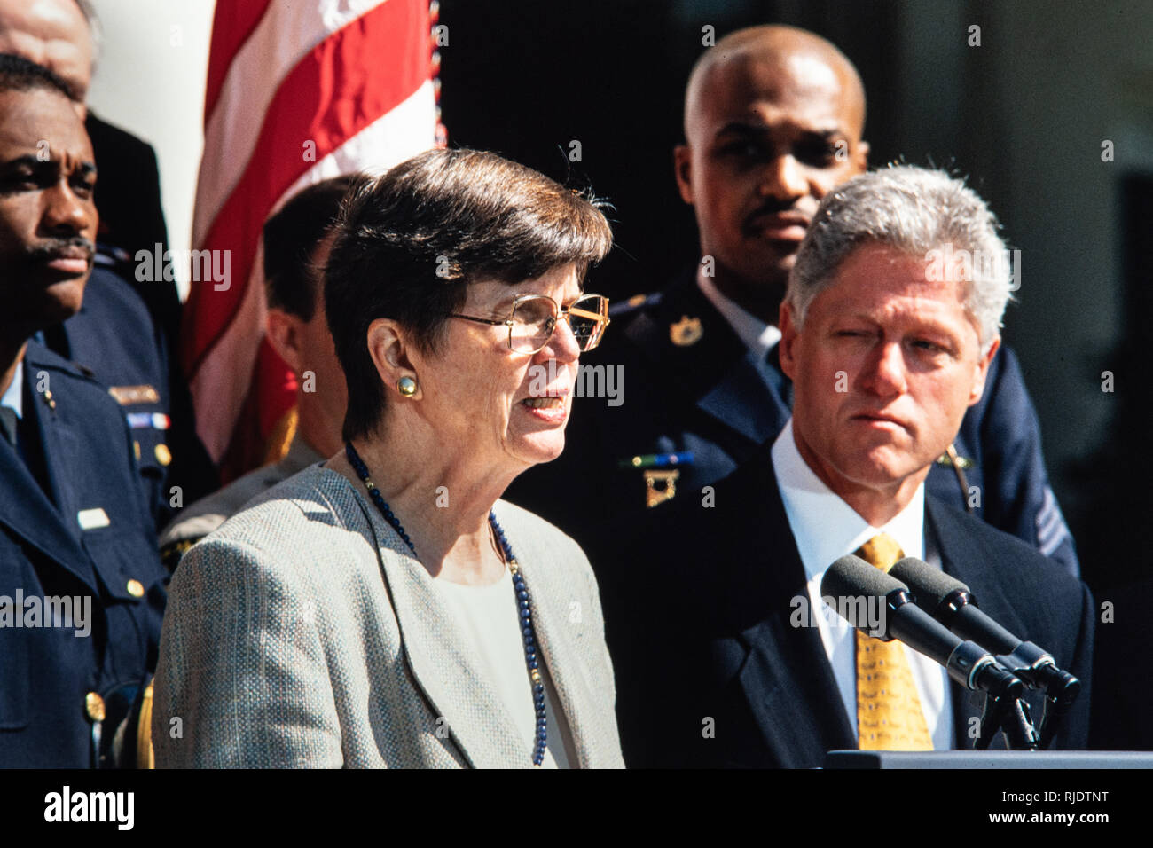 U.S Attorney General Janet Reno, left, speaks as President Bill Clinton ...
