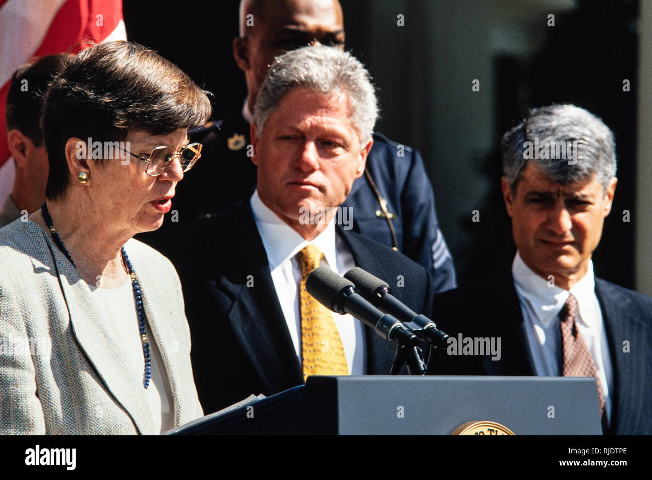 U.S Attorney General Janet Reno, left, speaks as President Bill Clinton ...
