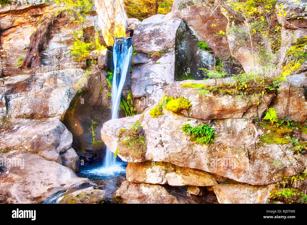 A small waterfall and pools of water at Kent Falls State Park in Kent ...