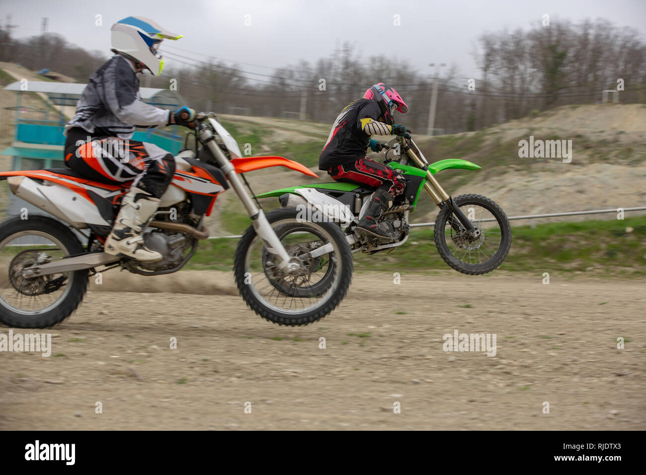 Professional motocross motorcycle rider driving hi-res stock ...
