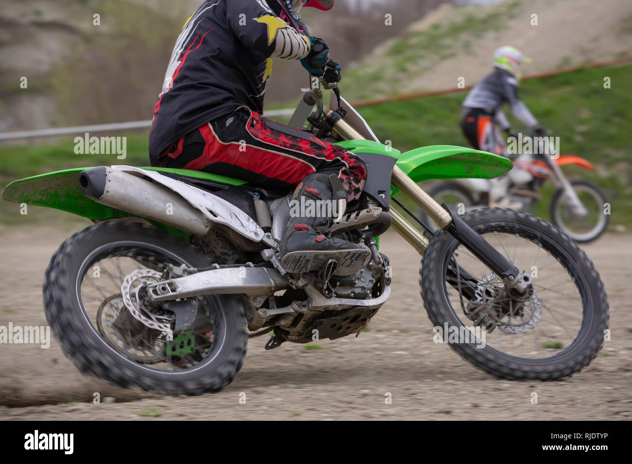 Professional motocross motorcycle rider driving hi-res stock ...