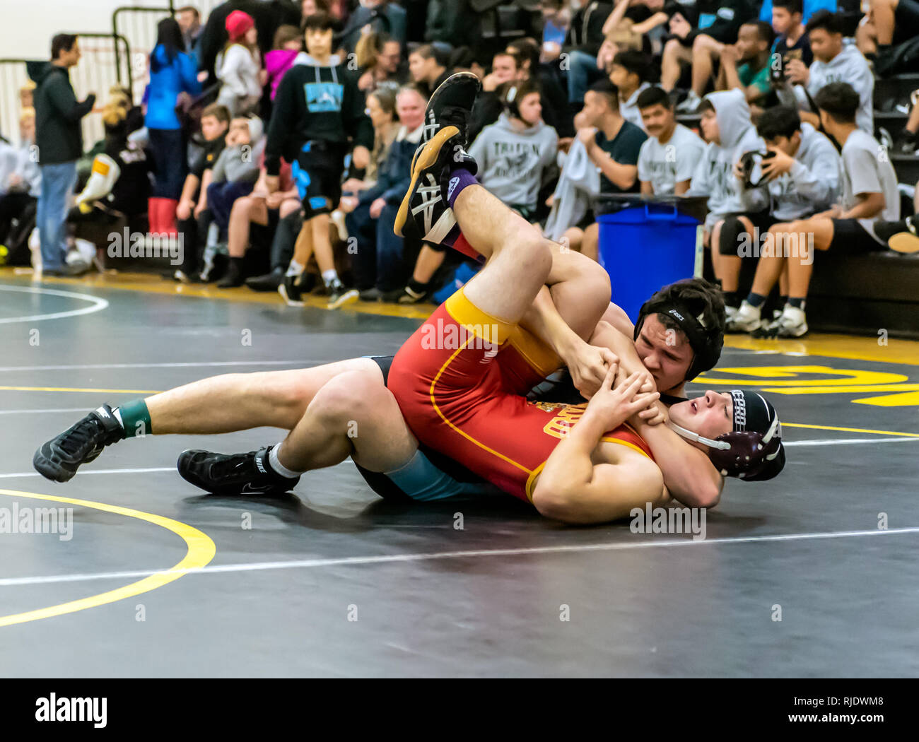 Wrestler from Buena High School holding a cradle on Oxnard athlete ...