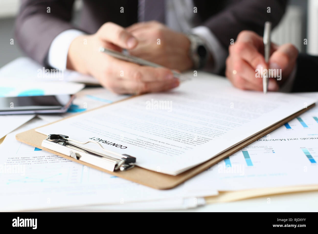 Male arm in suit and tie fill form clipped Stock Photo - Alamy