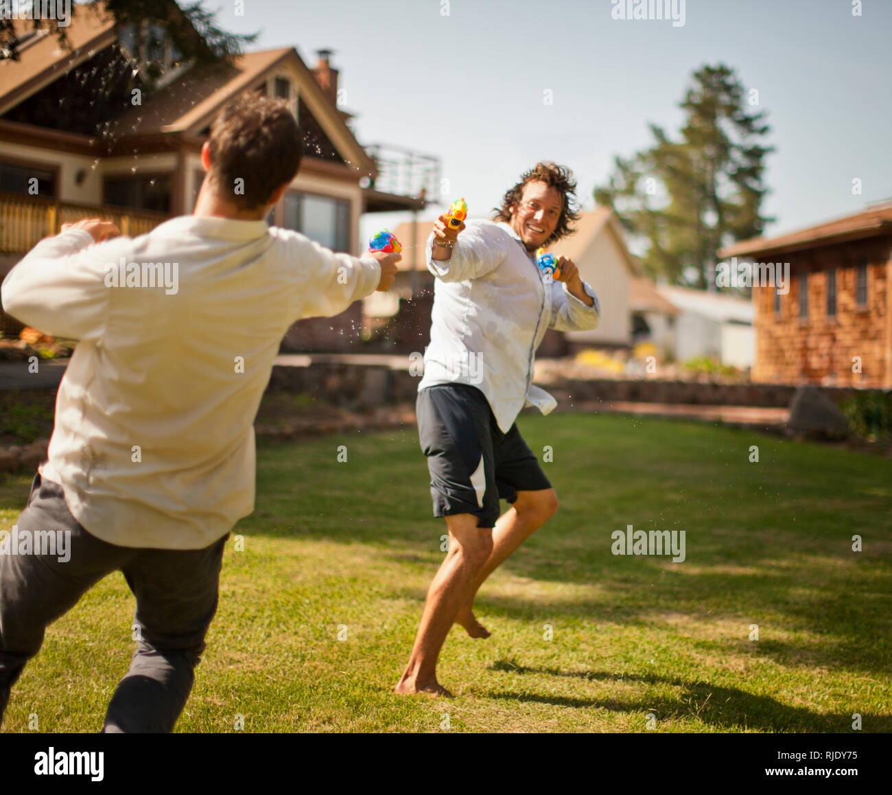 Mid adult man play fighting hi-res stock photography and images - Alamy