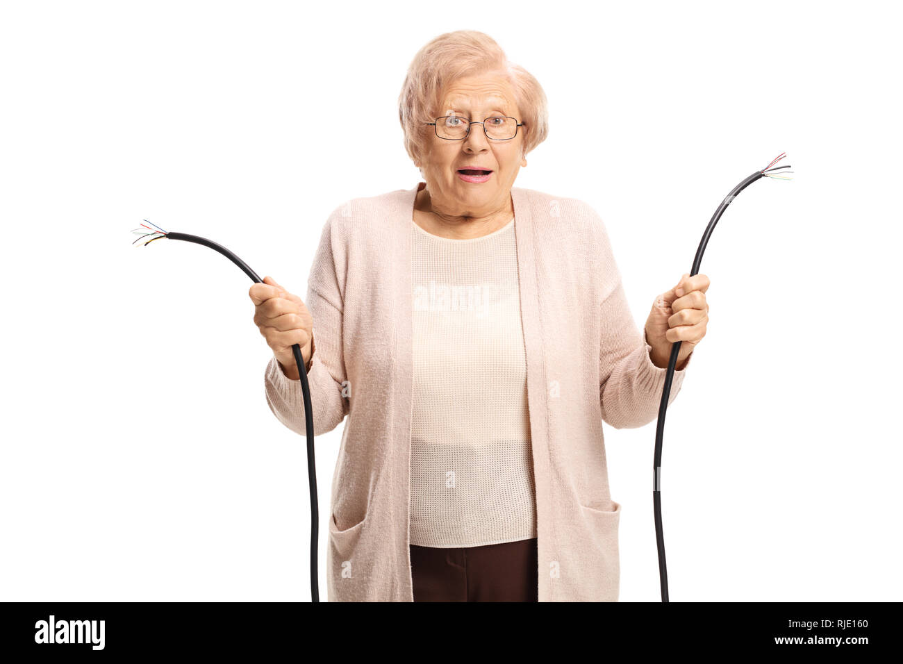 Confused old lady holding a broken cable isolated on white background ...