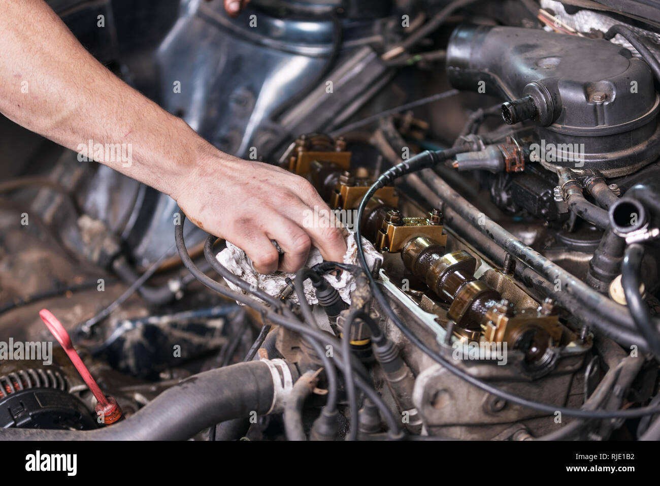 Mechanic working on car engine hi-res stock photography and images - Alamy